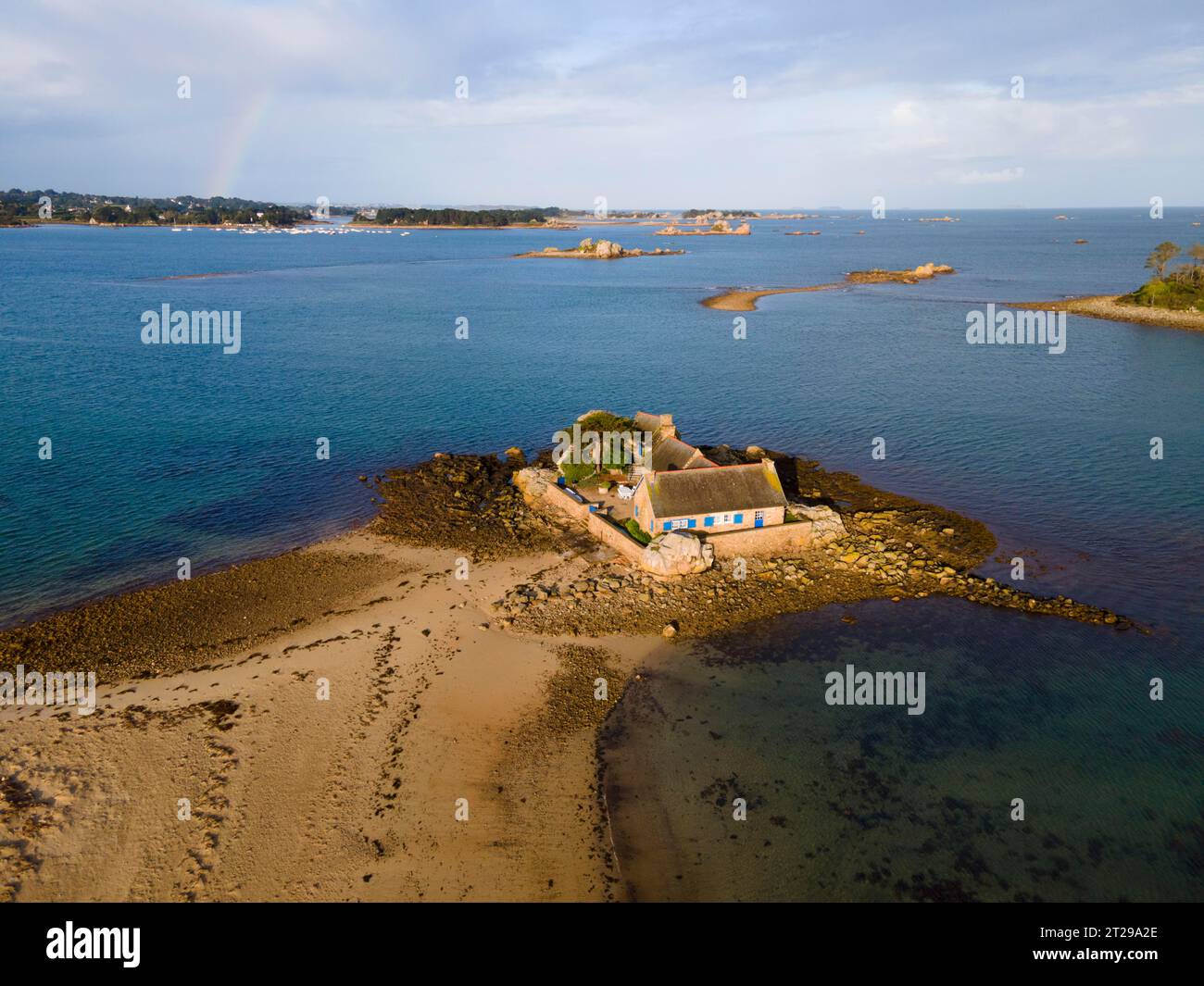 Aerial view, house at Plage de Raluzet with rainbow, Plougrescant ...