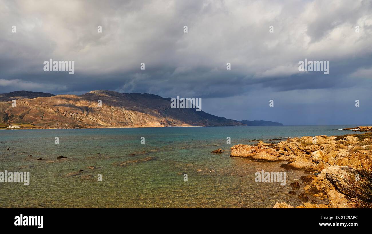 Dramatic cloudy sky, green sea, Gramvoussa Peninsula, Kissamos Gulf ...