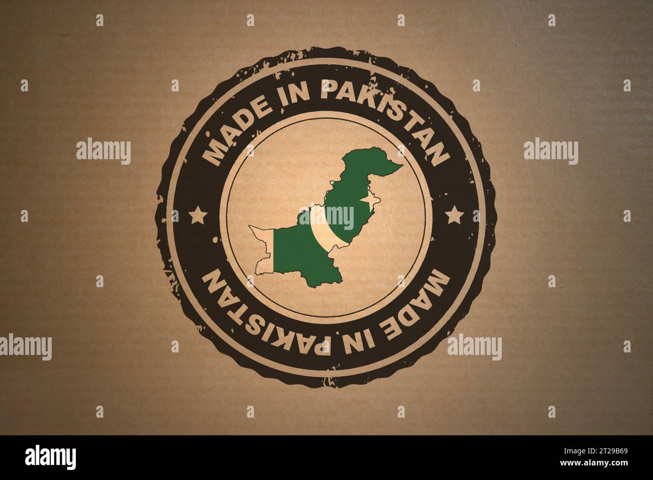 Brown paper with in its middle a retro style stamp Made in Pakistan ...
