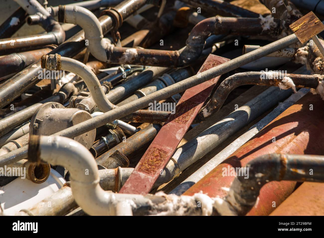 scrap metal in a container Stock Photo - Alamy