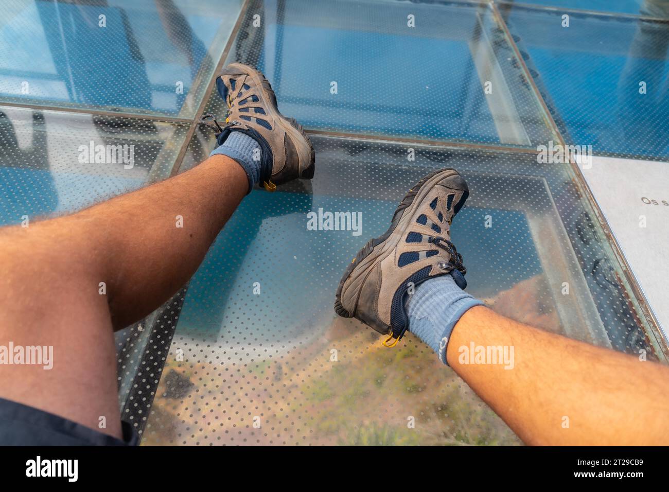 Looking at the glass floor at the highest viewpoint called Cabo Girao ...