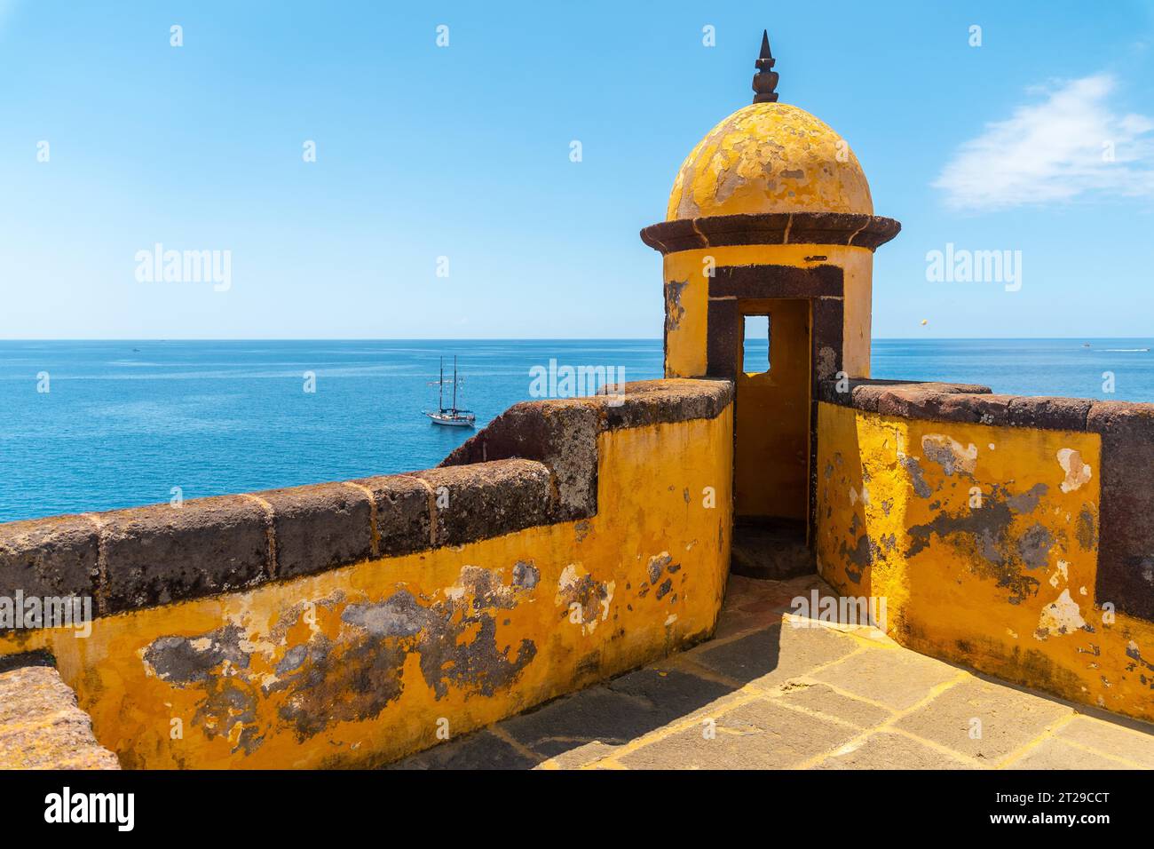 Yellow watchtower at the Forte de Sao Tiago fort in Funchal by the sea ...