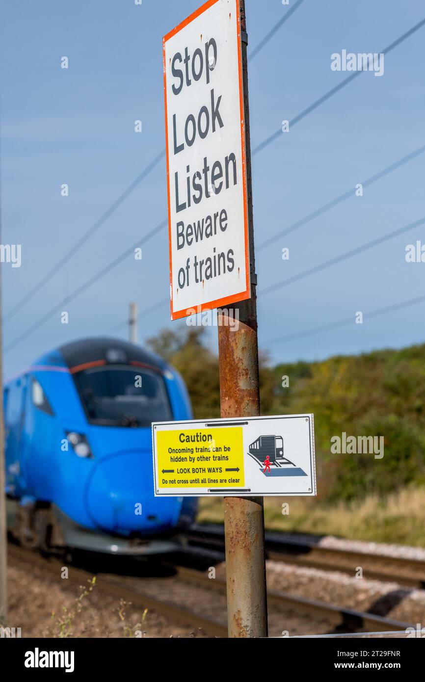 Caution, Look both ways and Stop Look Listern warning signs at level ... Caution, Look both ways and Stop Look Listern warning signs at level ...