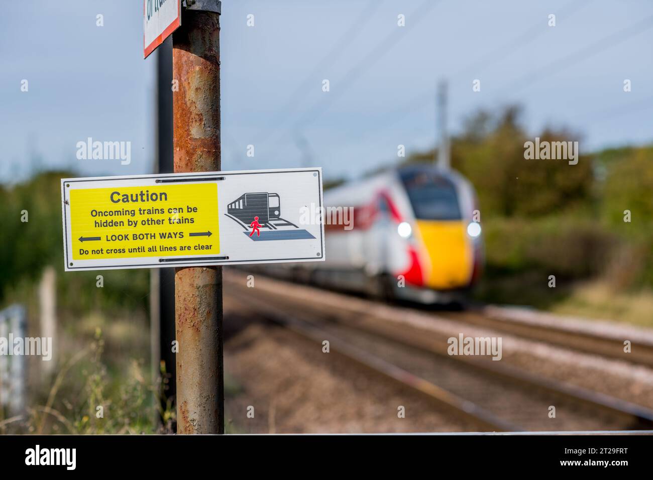 Caution, Look both ways, warning sign at level crossing on the East ...