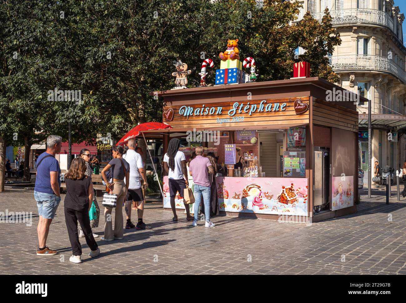 People queue for ice creams at a stall called Maison Stephane in Pl ...