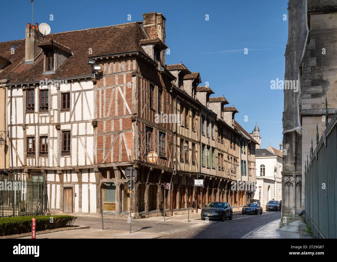 A row of well preserved traditional ancient medieval houses next to the ...