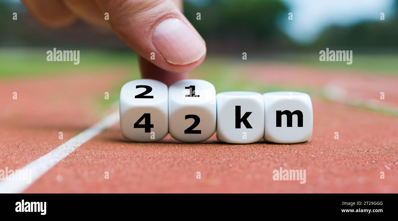 Dice form the expression '21 km' and '42 km'. Symbol for the distance ...