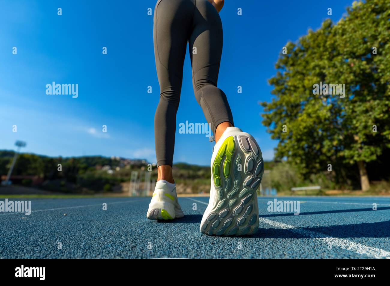 Close-up high angle view of a flexed running shoe sole of a female ...