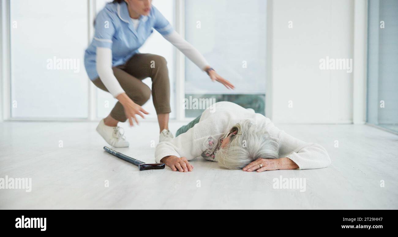 Accident, help and nurse with old woman on floor for medical, injury ...