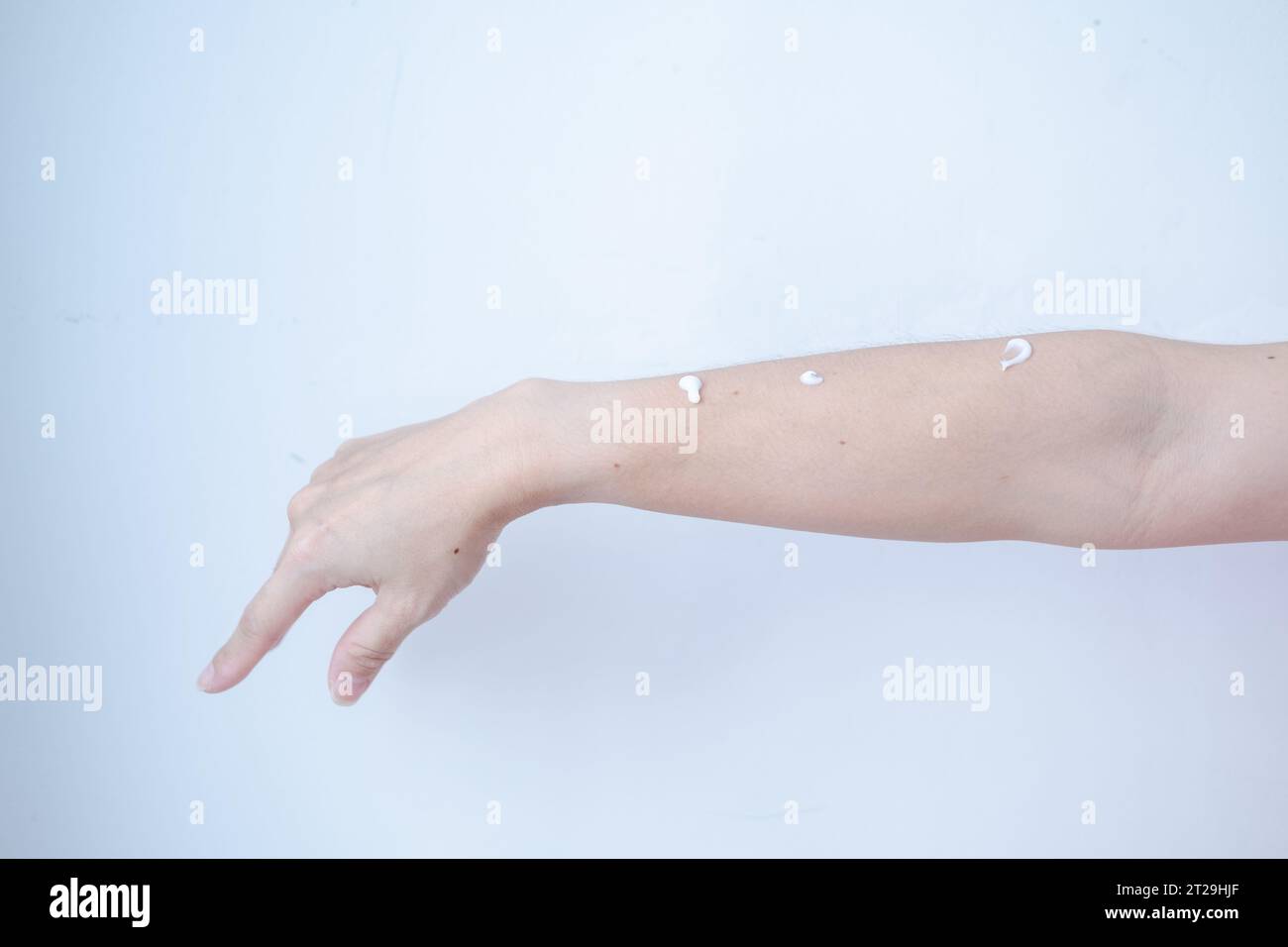 Woman's arm with skin cream waiting for skin care rub Stock Photo - Alamy