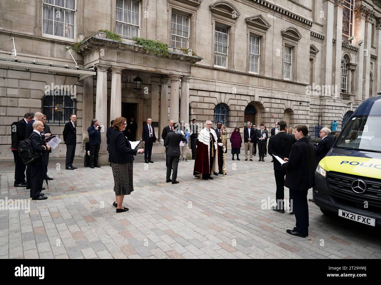Outgoing Lord Mayor of London Nicholas Lyons (centre) stands next to ...