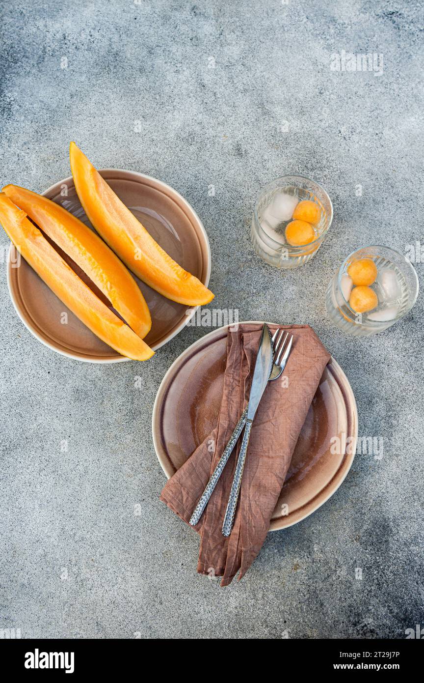 Top view of sliced organic fresh orange musk melon fruit and melon ...