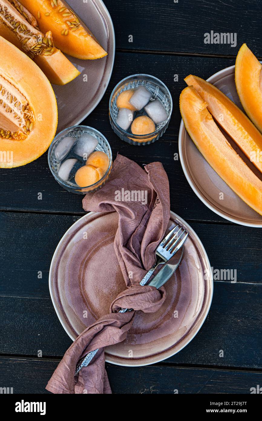 Top view of sliced organic fresh orange musk melon fruit and melon ...
