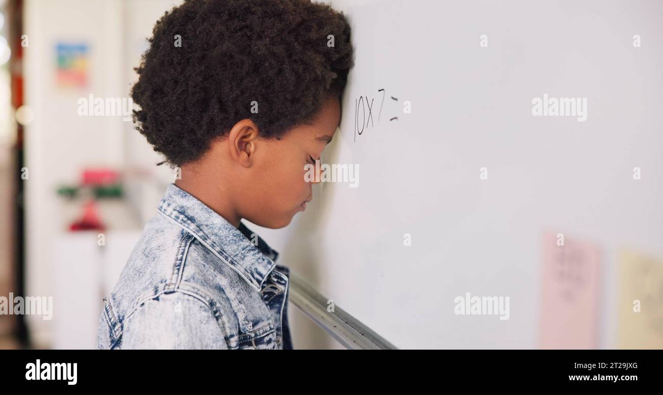 Math class, sad child at board for education, learning and problem ...
