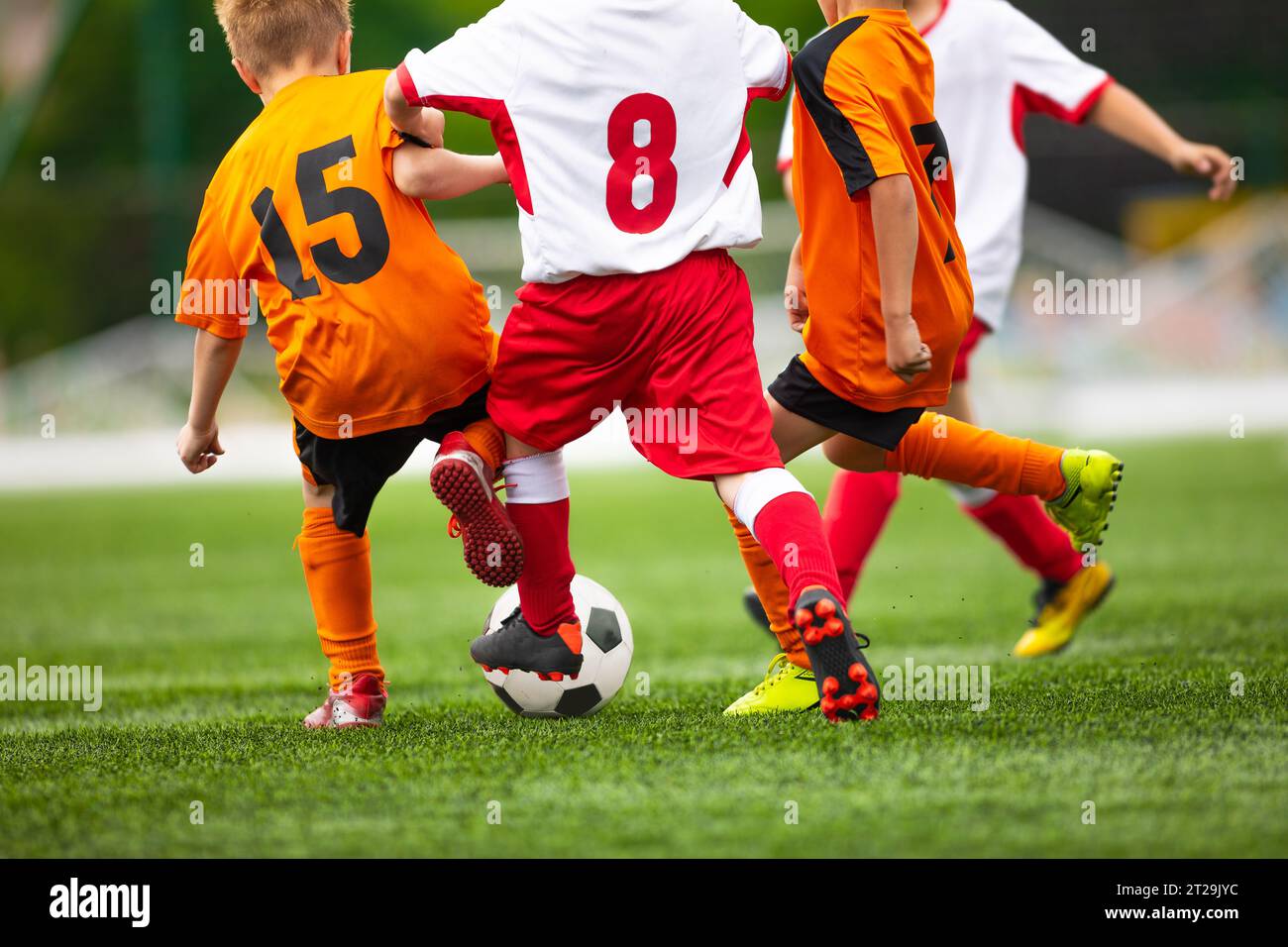 Young boys playing football game on a school tournament. Football ...