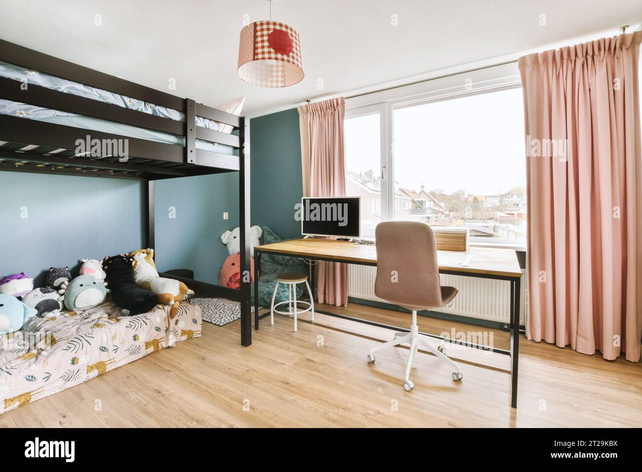 Interior of child's room with various stuffed toys on bunk bed and ...