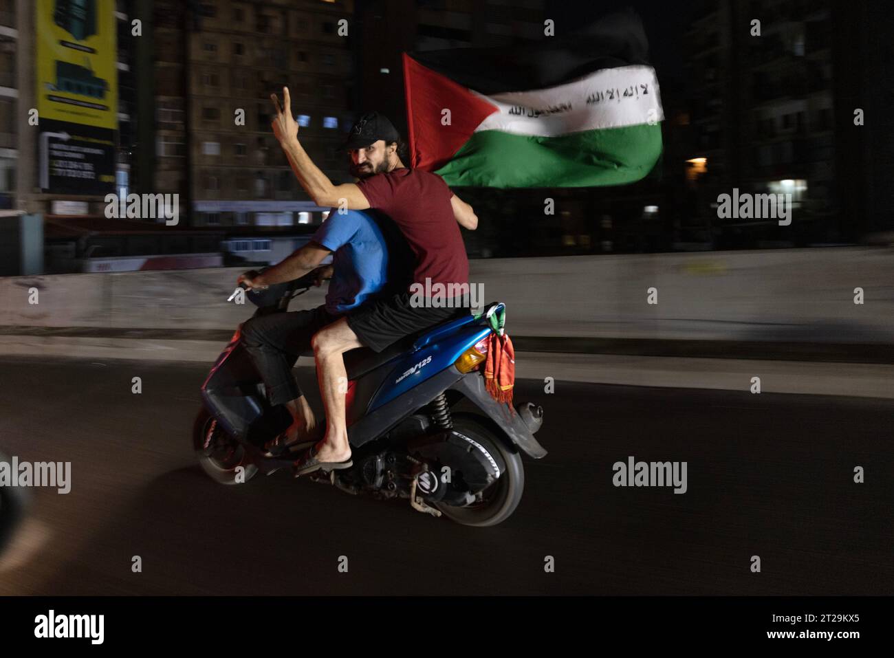 Awkar, Lebanon. 17th Oct, 2023. A demonstrator drives toward a protest ...