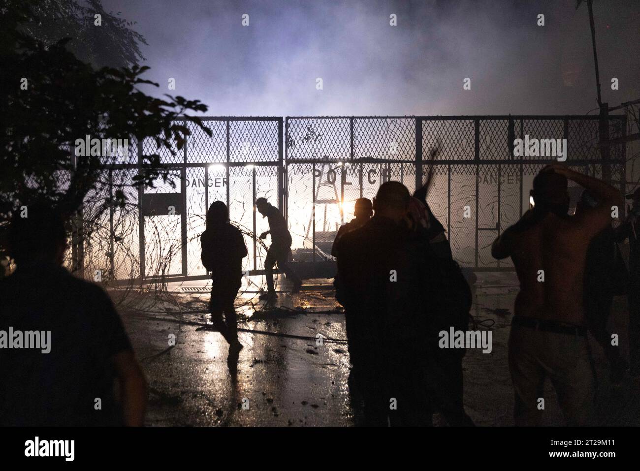 Awkar, Lebanon. 18th Oct, 2023. Demonstrators throw rocks while ...