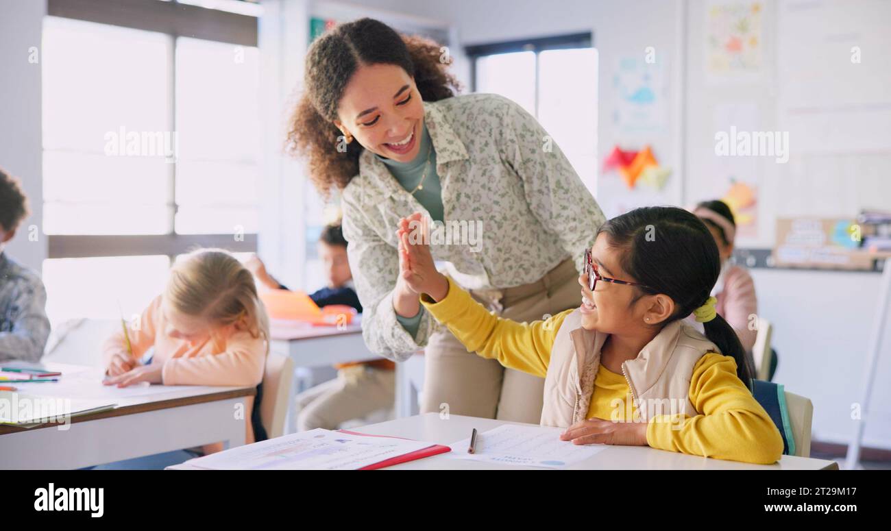 Teacher woman, high five girl and classroom with achievement, success ...