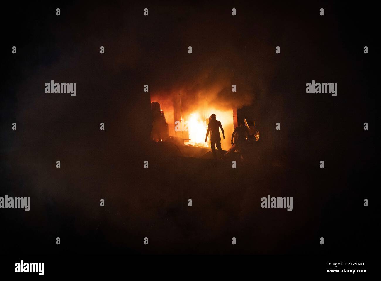 Awkar, Lebanon. 18th Oct, 2023. Demonstrators ignite a building on fire ...