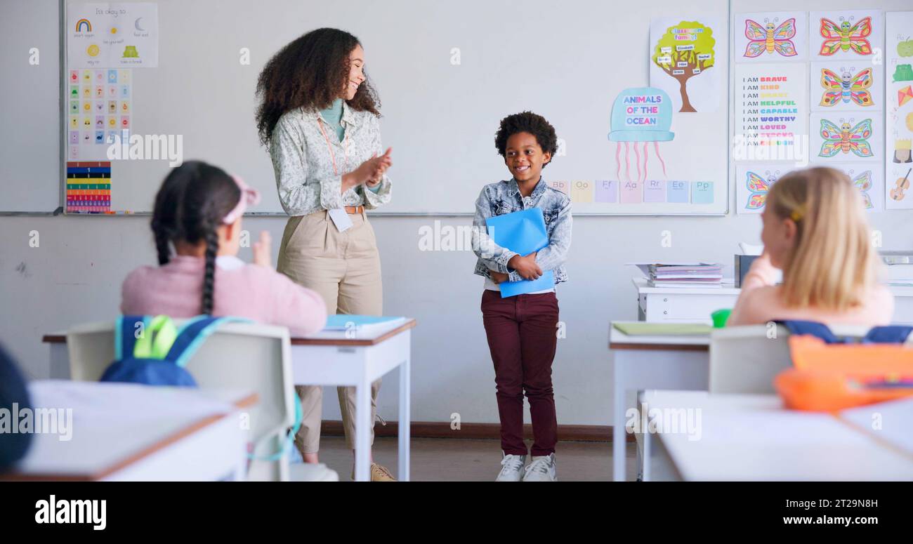 Class paper, presentation and child speaker with applause and cheering ...