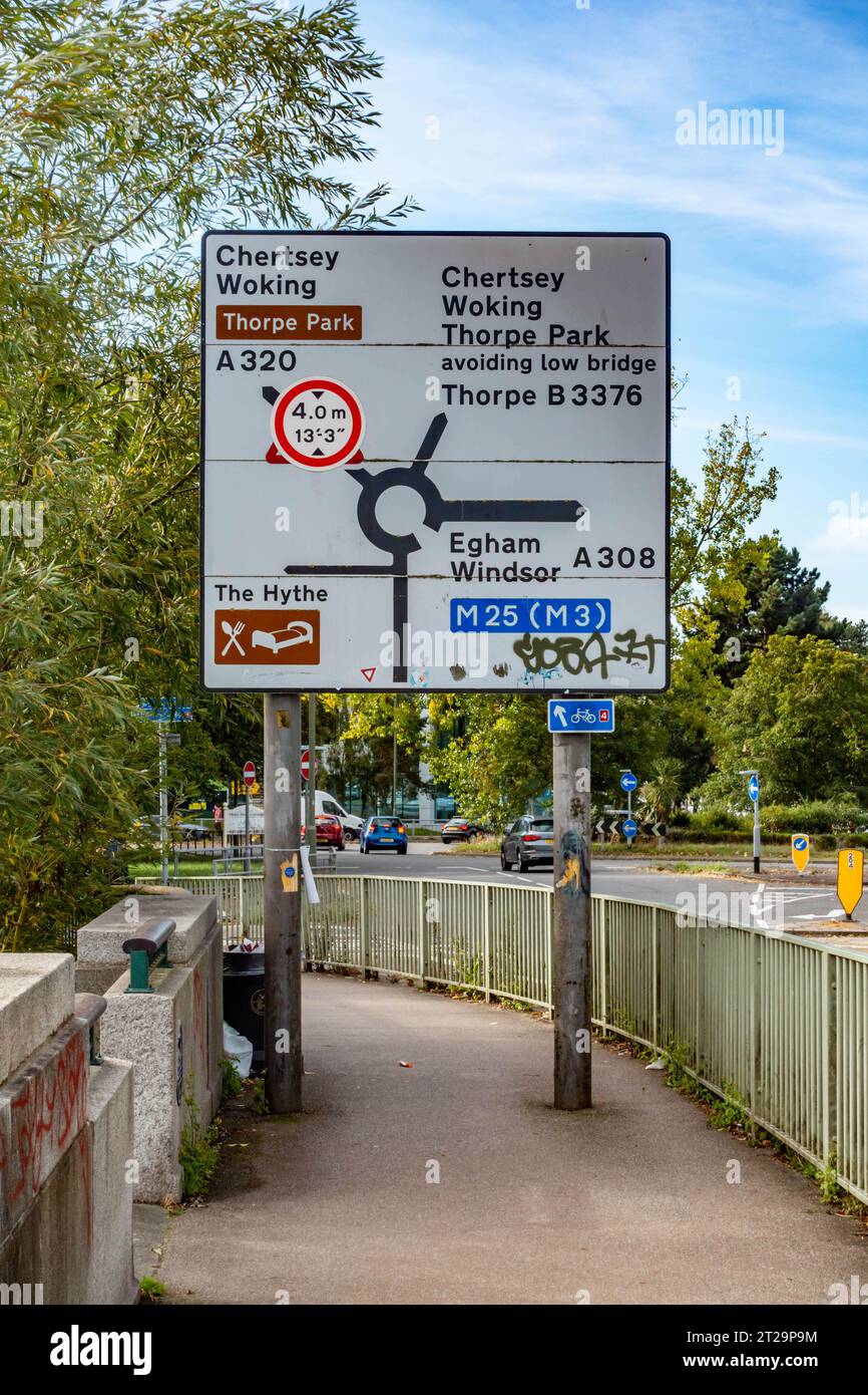 A large road sign at the end of Staines Bridge in Staines-upon-Thames ...
