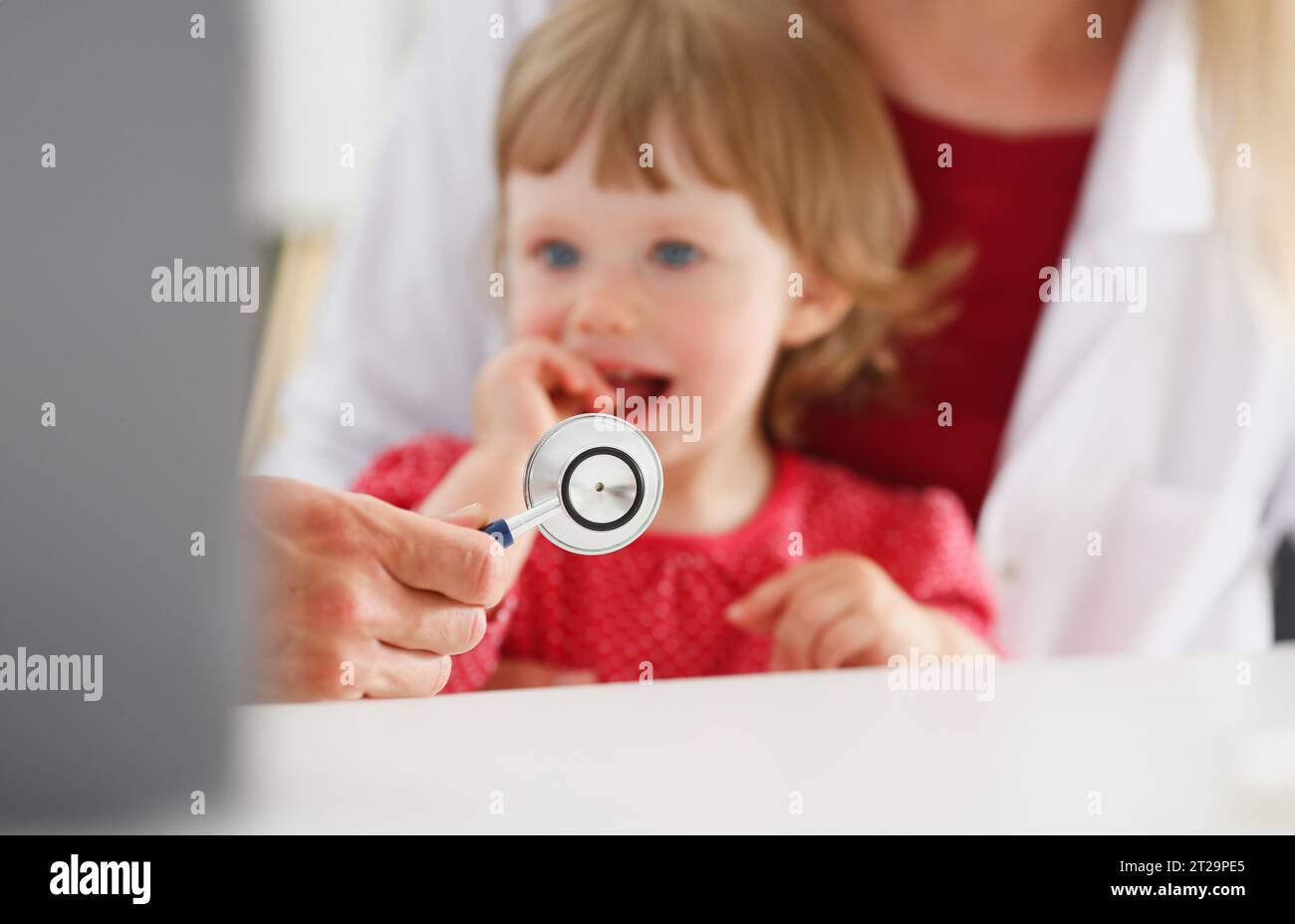 Little scared child at doctor reception Stock Photo - Alamy