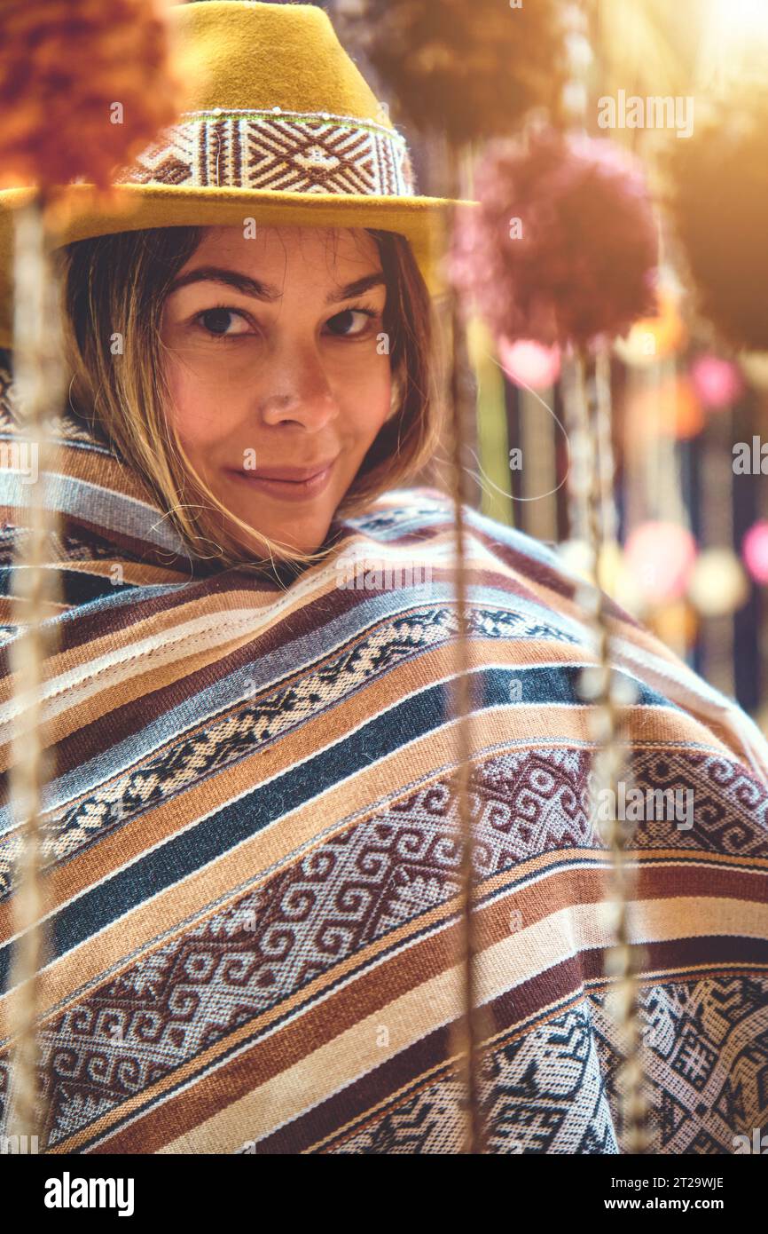 Woman with hat. Hipster girl with andean look wearing poncho, young ... Woman with hat. Hipster girl with andean look wearing poncho, young ...