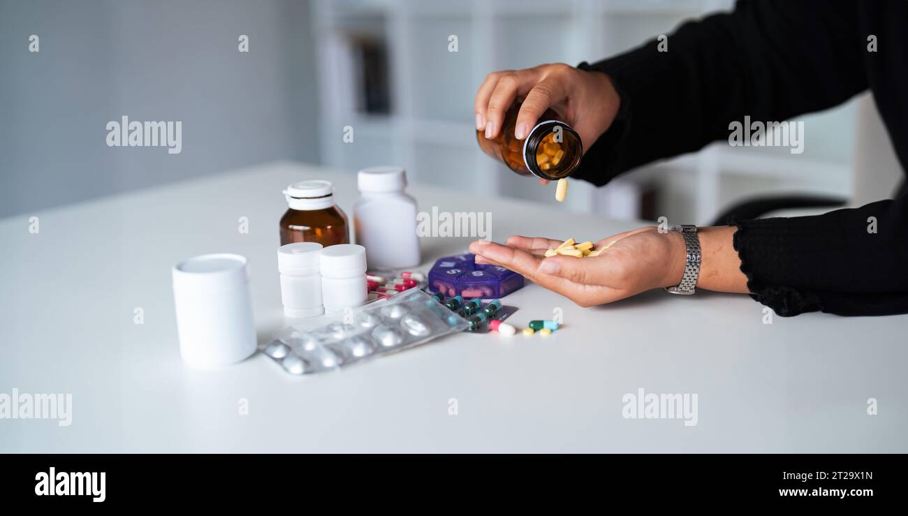 Sick illness woman hold two pill on hand pouring capsules from ...