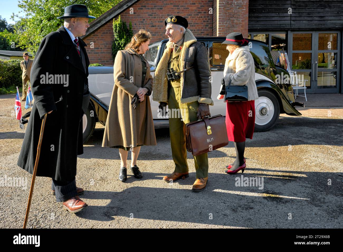 1940s people in vintage costume at a 1940s WW2 reenactment, Avoncroft Museum Bromsgrove, England ...