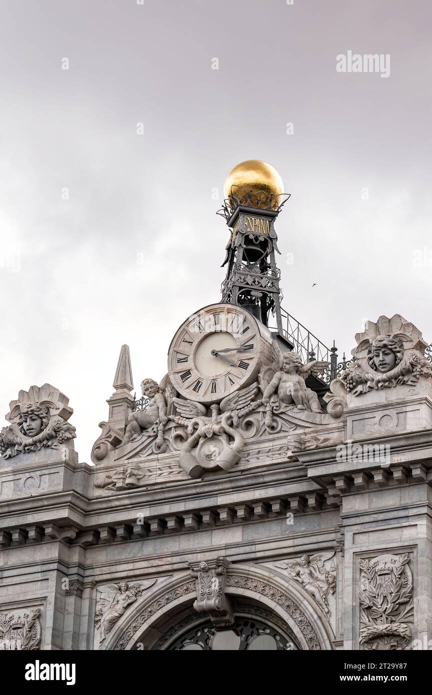 Detail of the facade of the Bank of Spain building with its clock and a ...