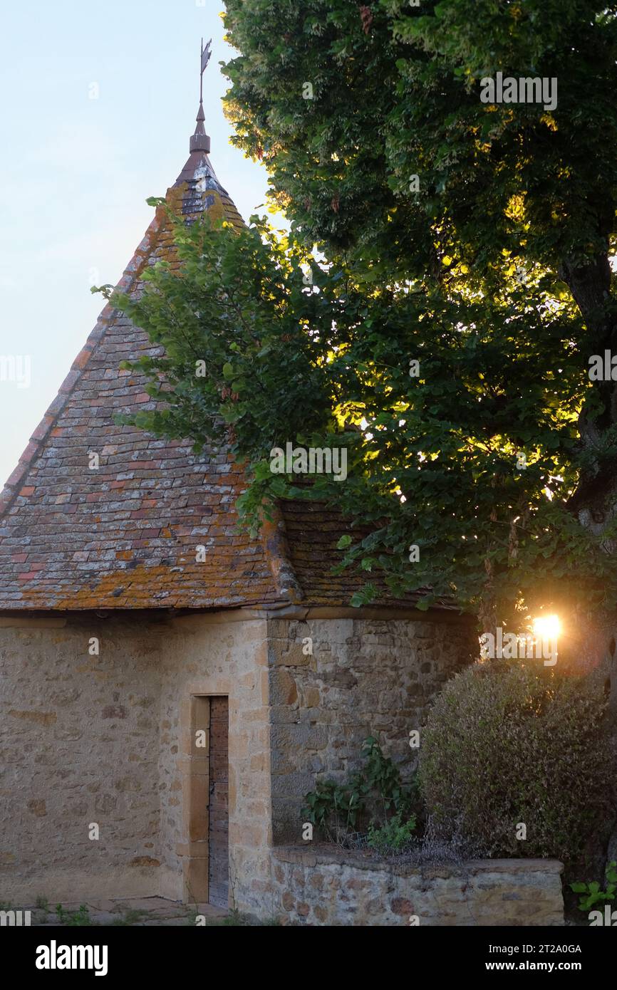 A small medieval stone tower on the terrace wall of Chateau Bagnols ...