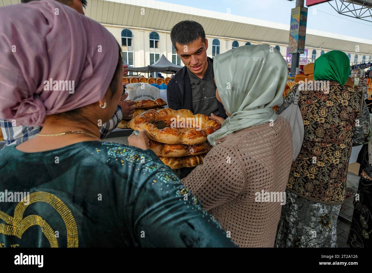 Fergana, Uzbekistan - October 18, 2023: A bread seller at the City ...