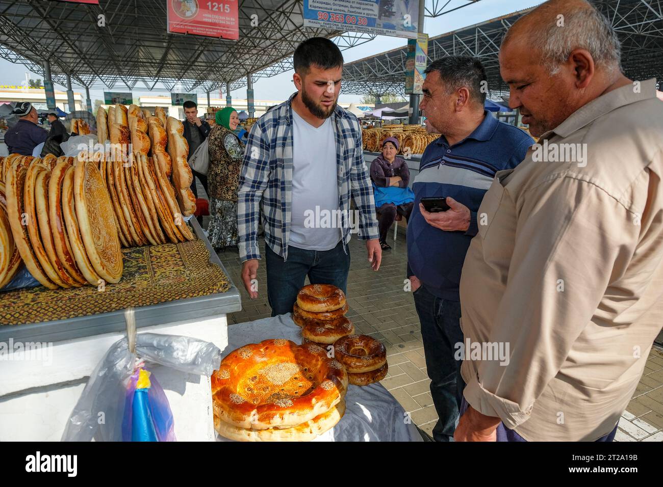 Fergana, Uzbekistan - October 18, 2023: A bread seller at the City ...