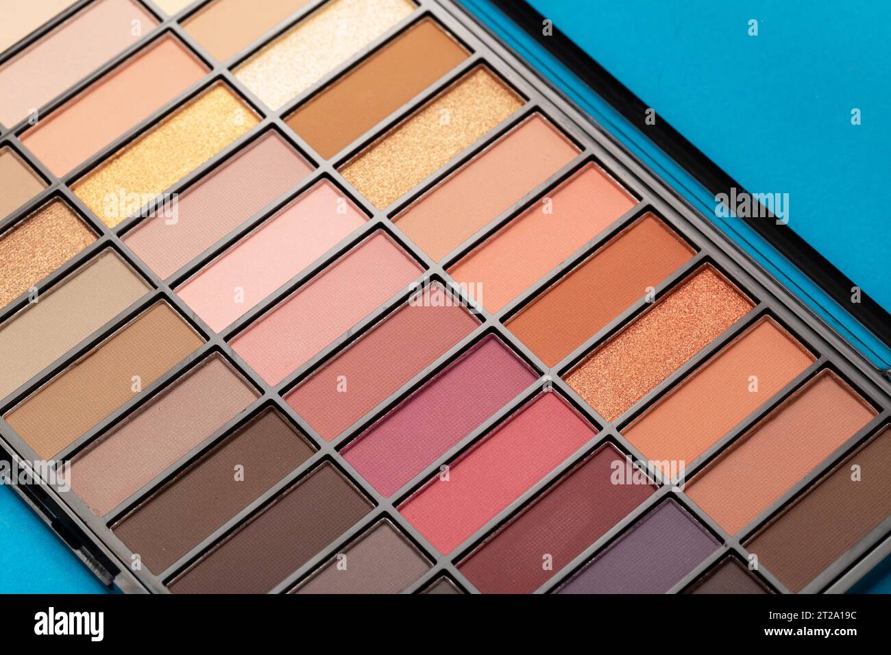 Modern trendy set of eye shadows on a blue background. Soft texture of ...