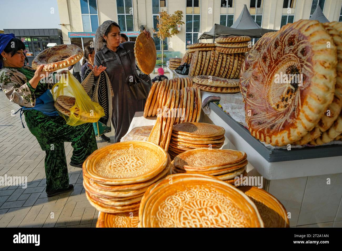 Fergana, Uzbekistan - October 18, 2023: A bread seller at the City ...