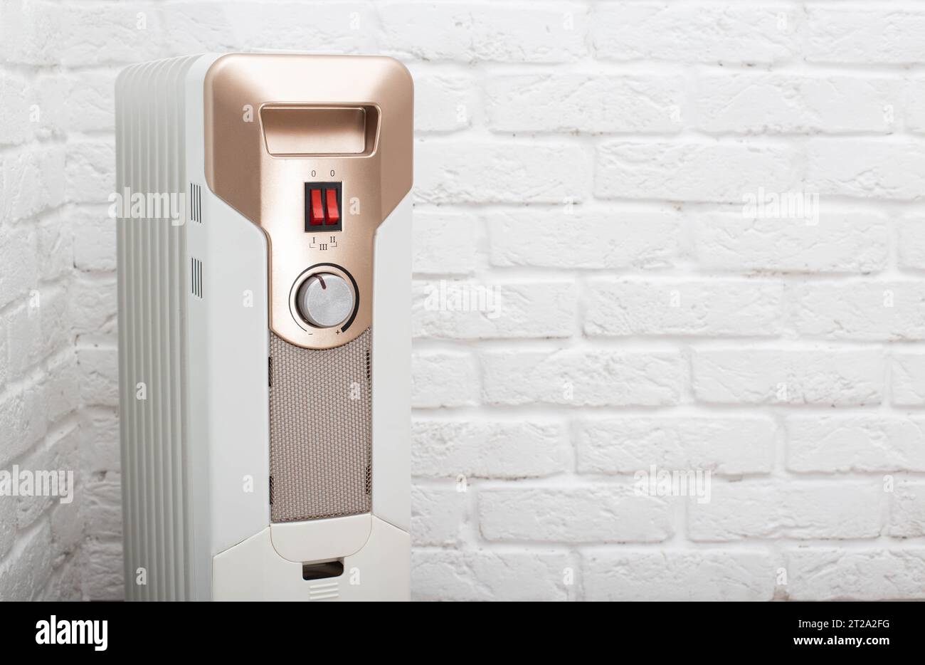 Electric heating radiator with temperature control on the background of ...