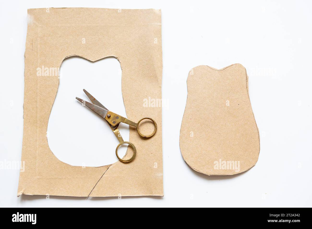 4 October 2023: A shape cut out of a cardboard box with scissors ...