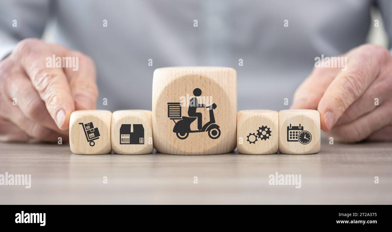 Wooden blocks with symbol of delivery concept Stock Photo - Alamy
