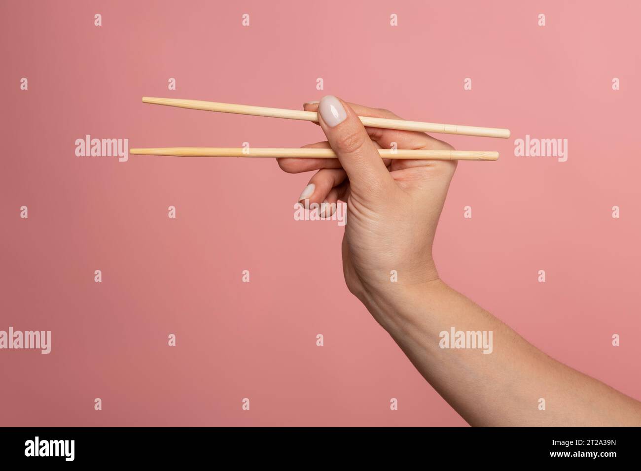 Adult person demonstrating during the studio photo shoot a couple of ...