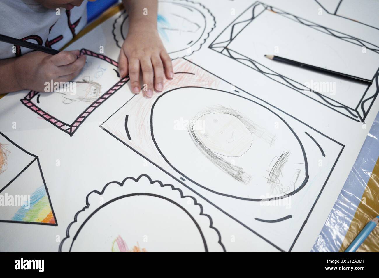 kids coloring on huge paper, draw yourself kids activity Stock Photo ...