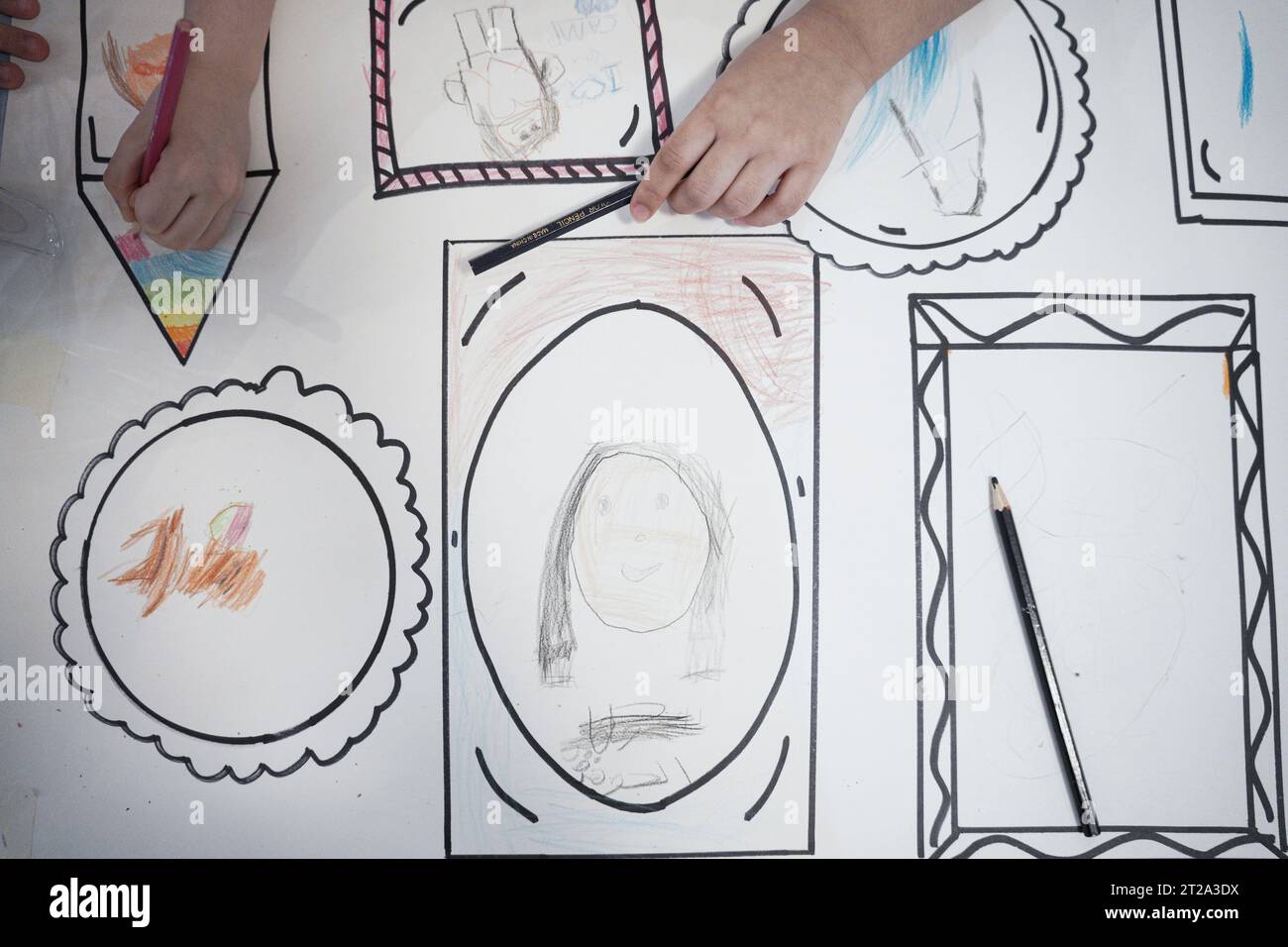 kids coloring on huge paper, draw yourself kids activity Stock Photo ...