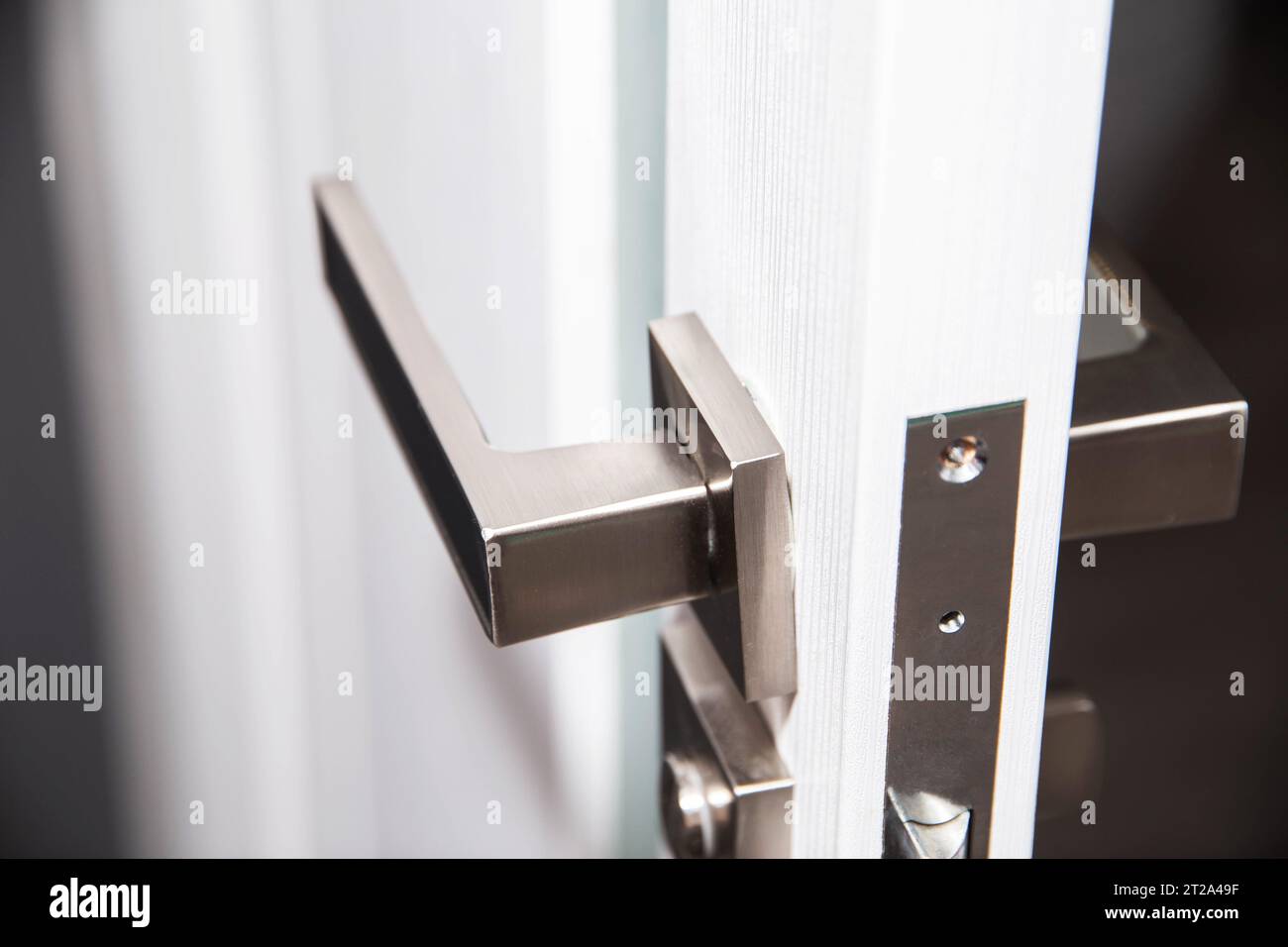 Broken doorknob in interior door. Poor quality fittings Stock Photo - Alamy