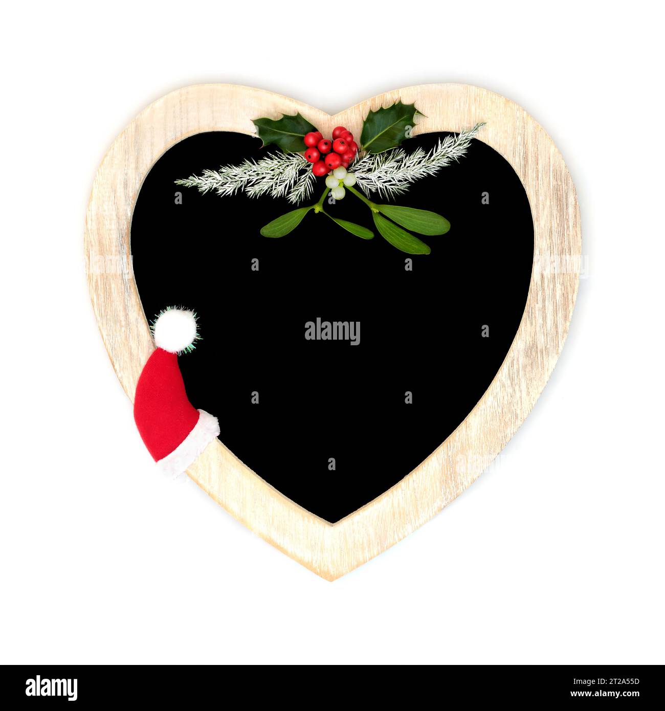 Christmas heart shape wreath with santa hat, winter holly, mistletoe ...