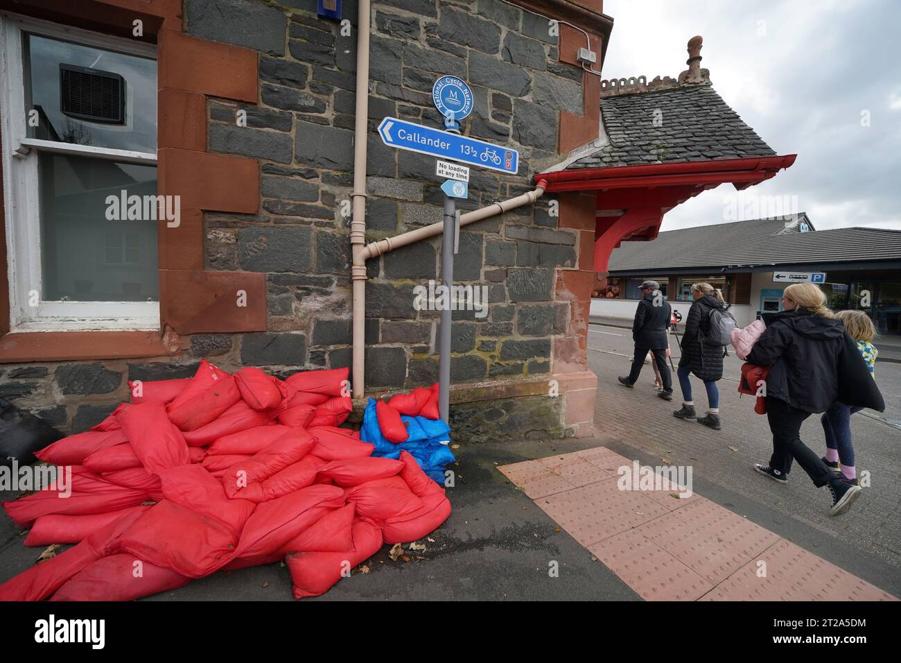 Sand bags sit piled against a wall in the main street in Aberfoyle in ...