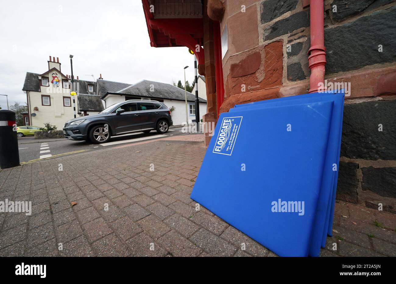 Flood prevention measures sit against a wall in the main street in ...