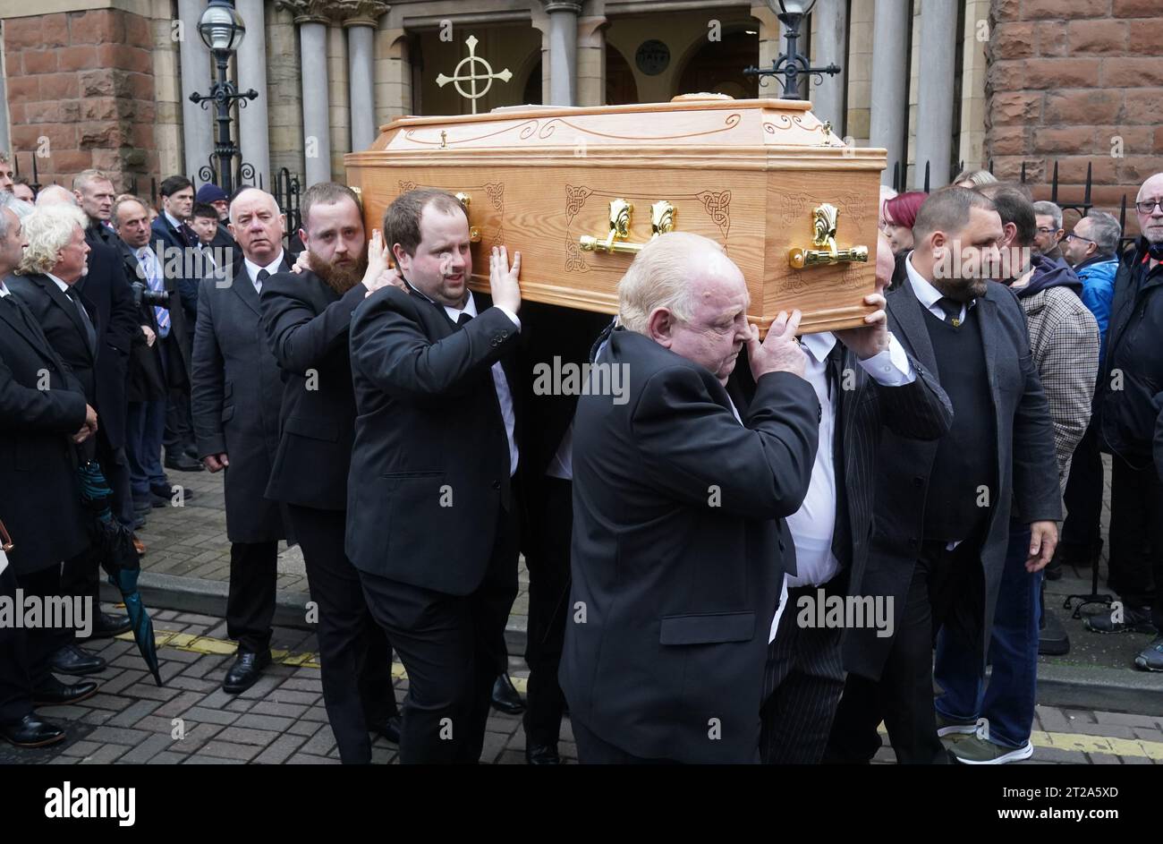 Photographers and members of the media make a Guard of Honour as the ...