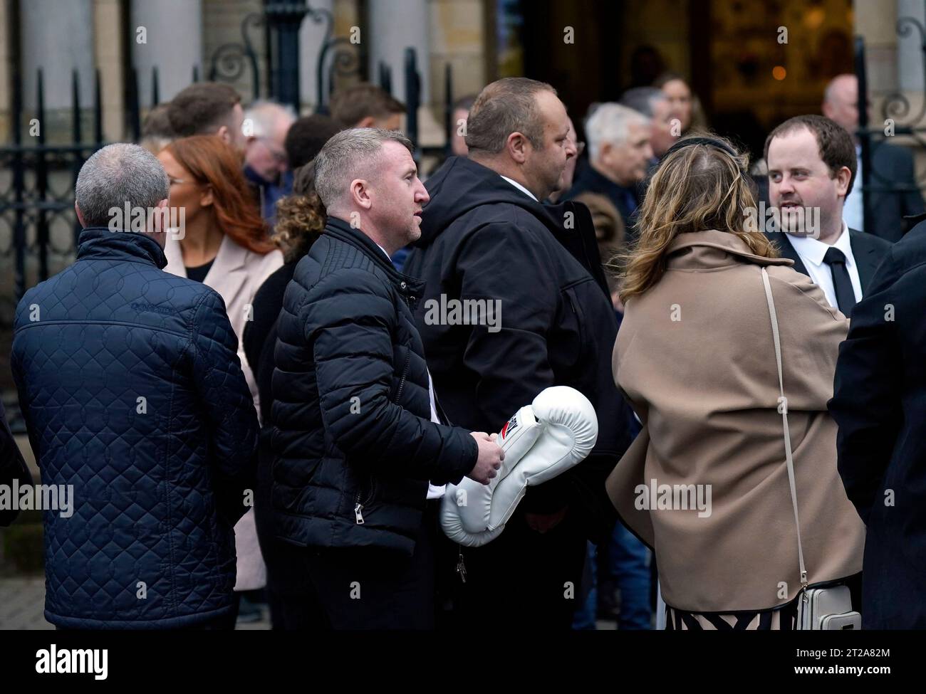 Olympic boxer Paddy Barnes carries a pair of white boxing gloves as he ...