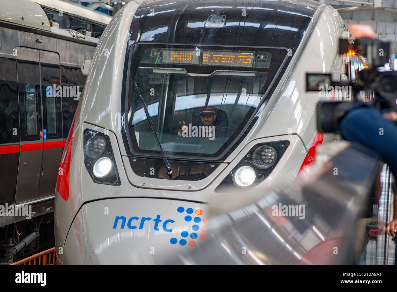 The train driver of the Regional Rapid Transit System is showing a ...