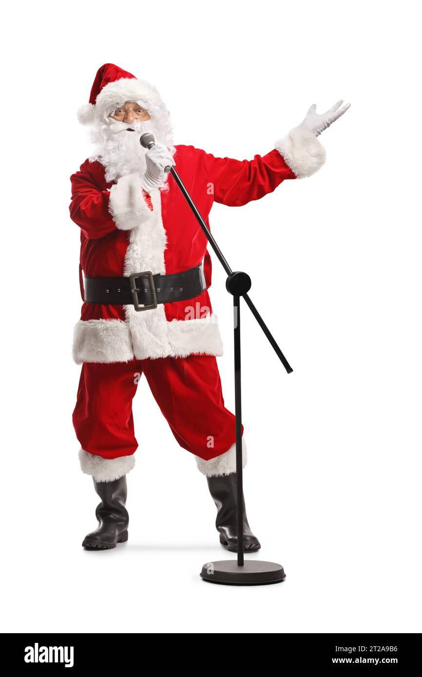 Cheerful santa claus with a microphone singing isolated on white ...